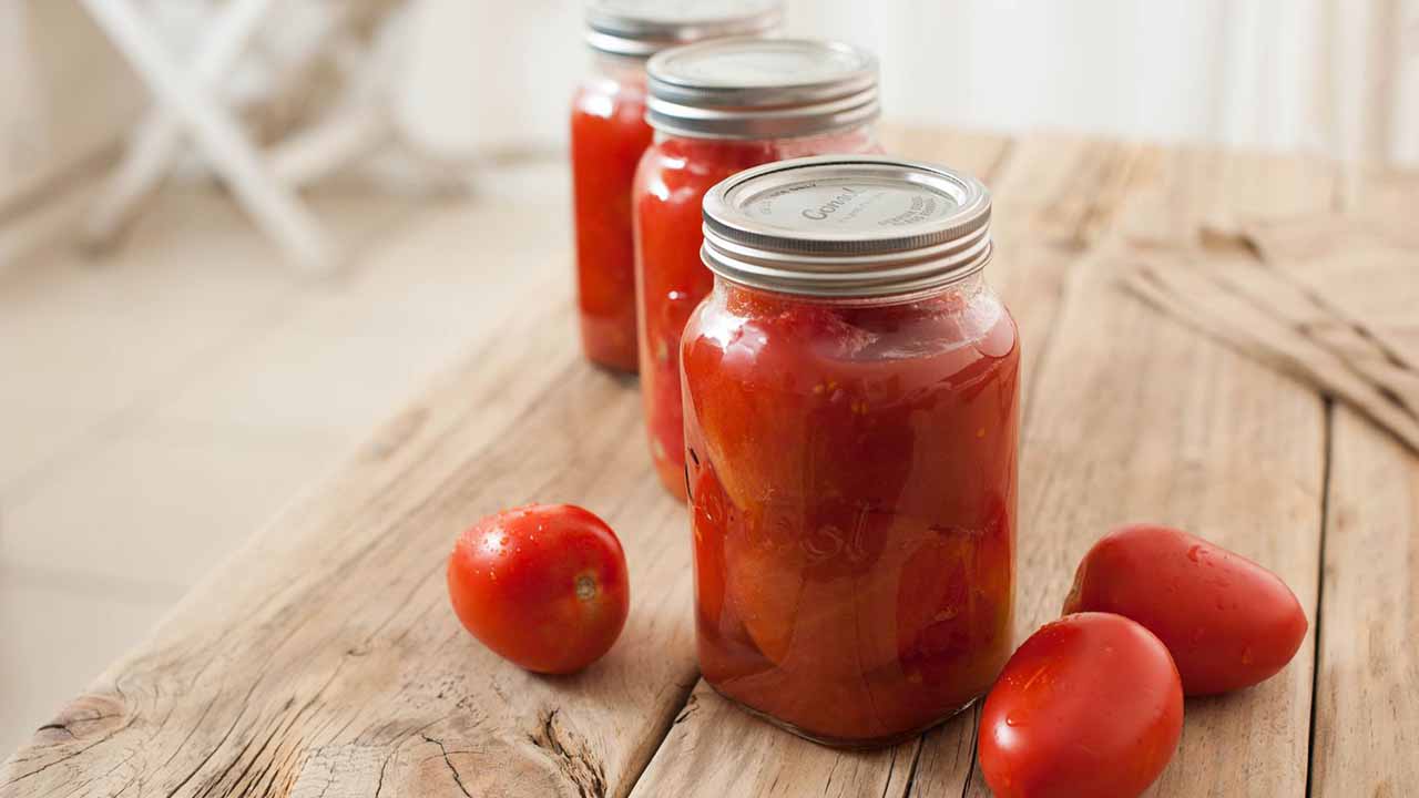 Preserve tomatoes by freezing, canning, and drying