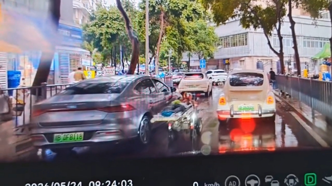 Man cruises through traffic on reclining hospital bed in China