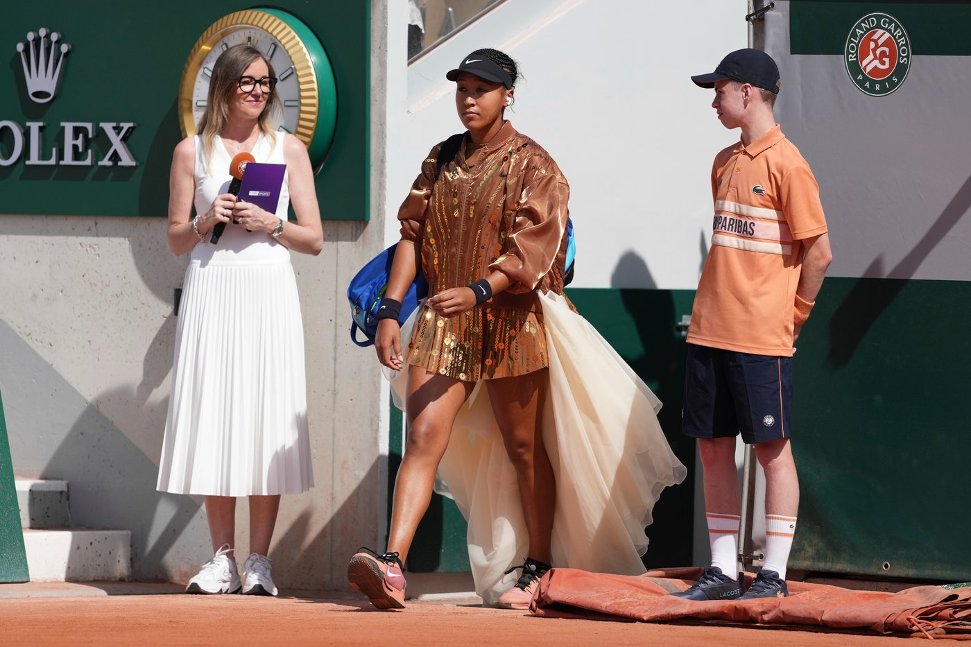 Osaka adds an ivory train and gold bomber jacket to her fashion ...