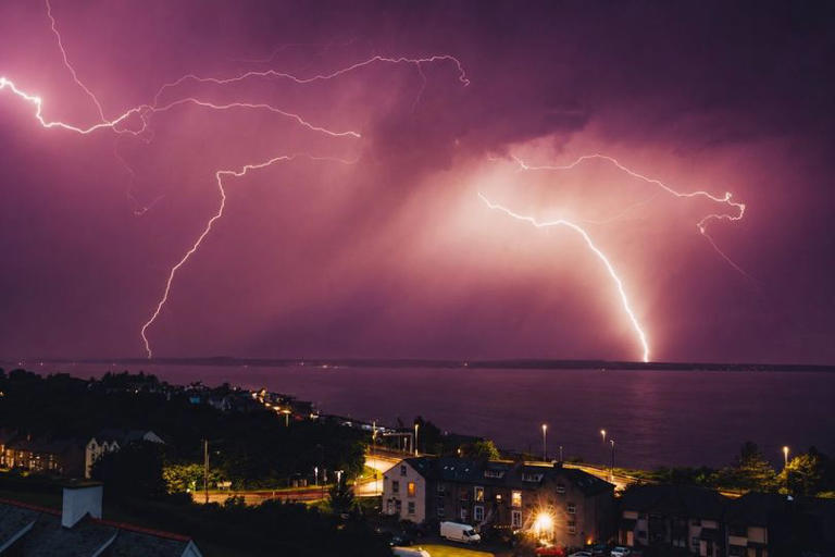'Pink lightning' fills North Wales sky as Anglesey 'disappears' on ...