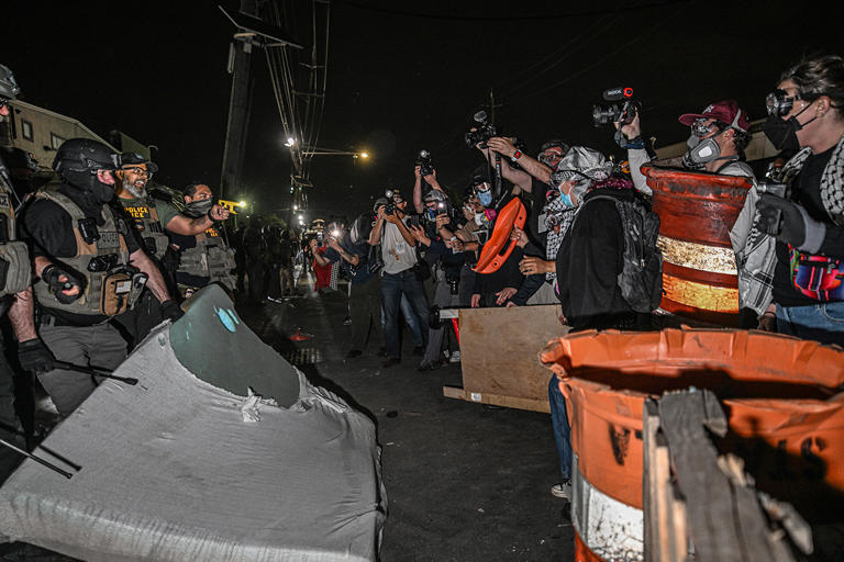 Night of chaos at Delaney Hall as ICE agents shove protester into path ...