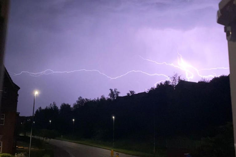 'Pink lightning' fills North Wales sky as Anglesey 'disappears' on ...