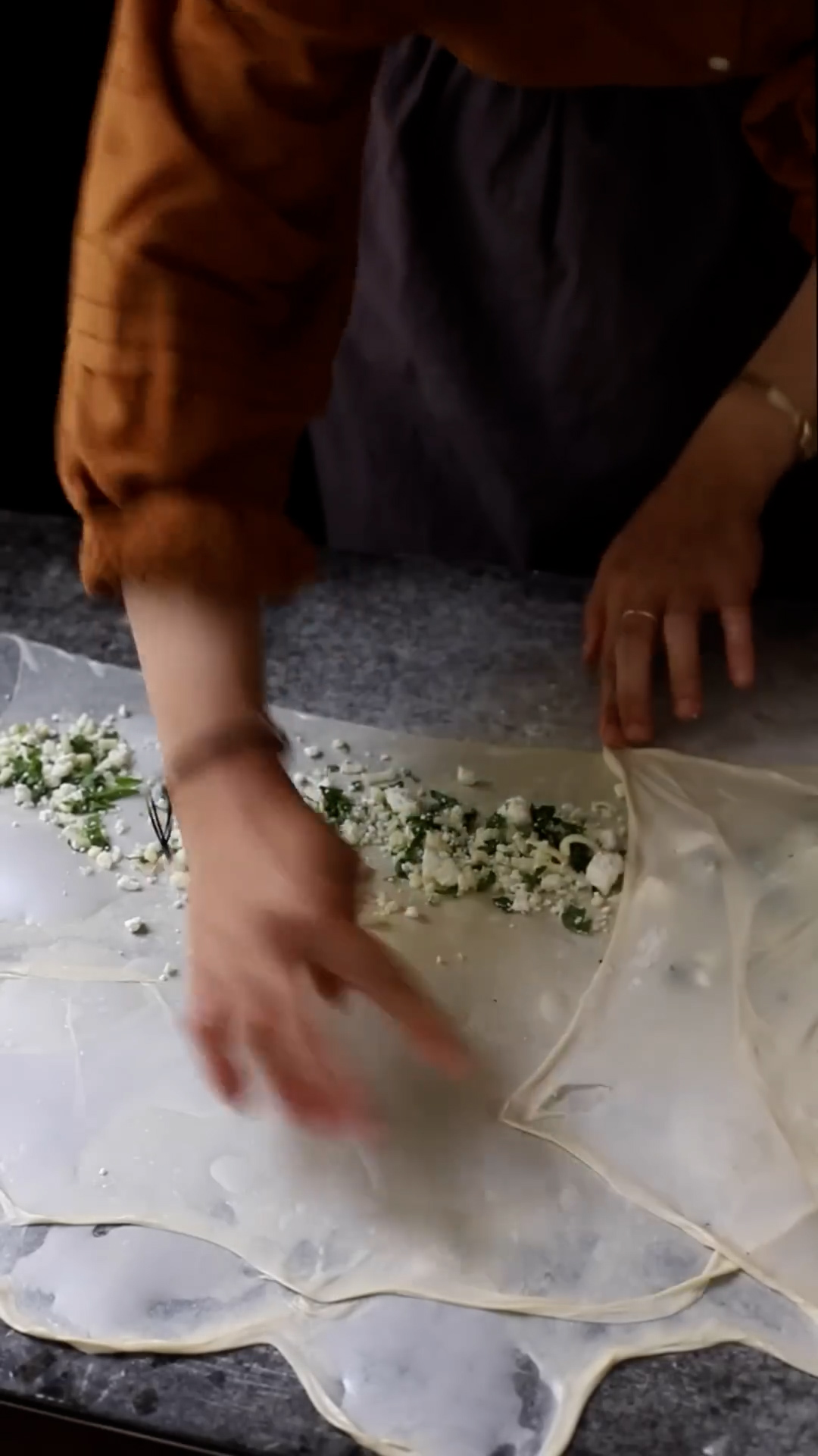 Layered Turkish pastry with feta and herbs