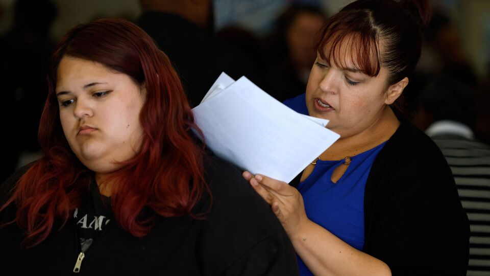 US jobless claims edge up to 215,000, but layoffs stay near historic ...