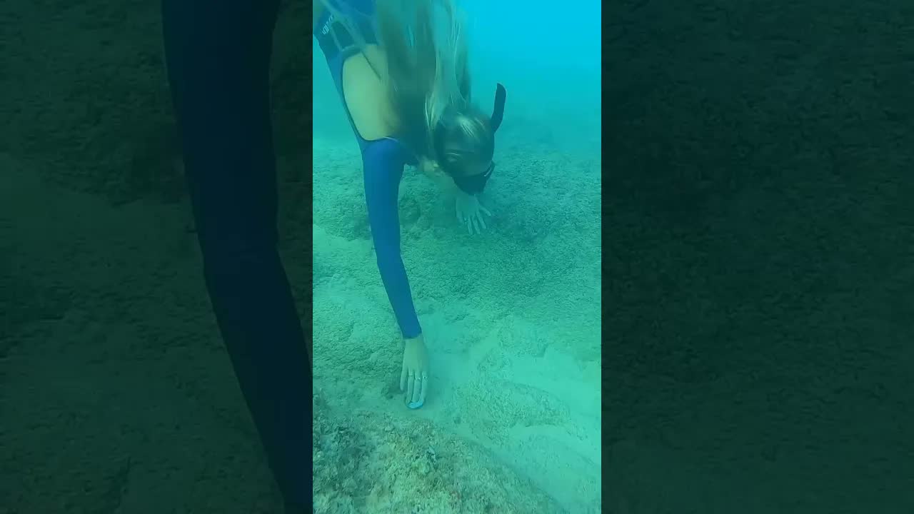 She reached into the murky water and instantly regretted it
