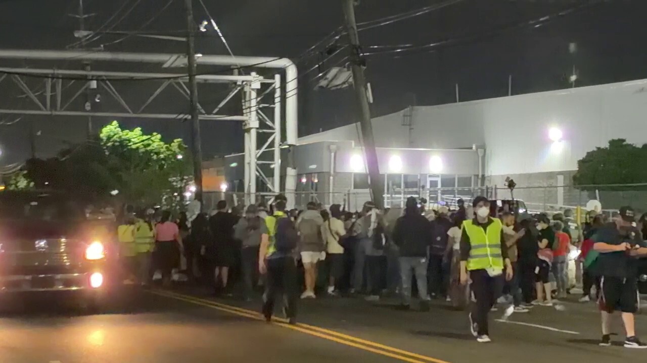 Anti-ICE agitators spill into roadway outside Delaney Hall detention ...