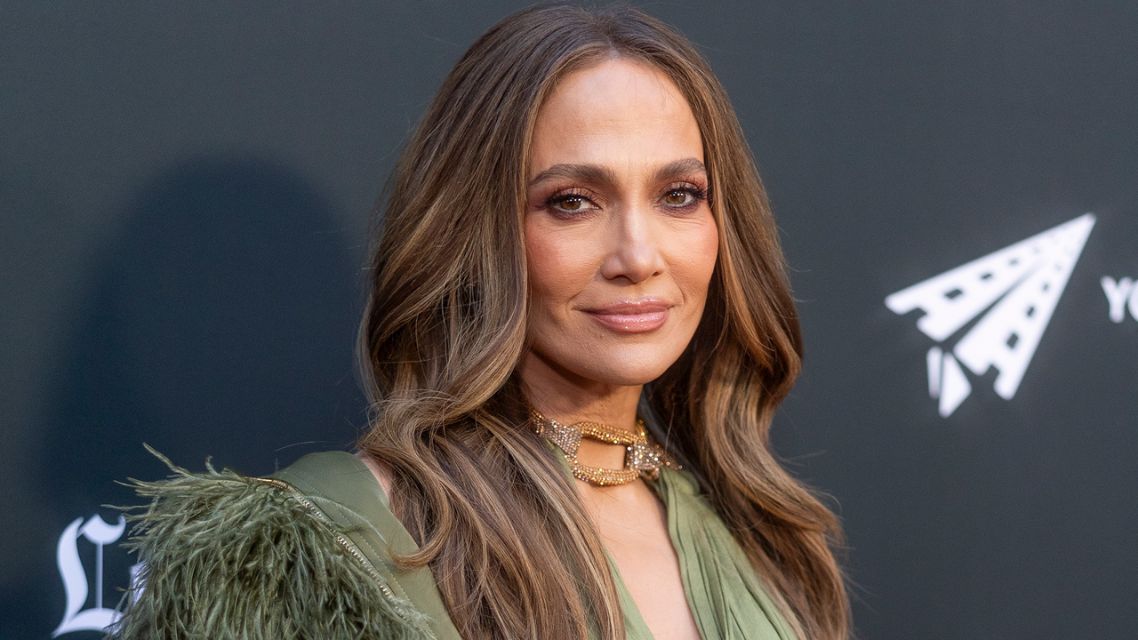 Jennifer Lopez trades work trousers for a daring cut-out dress