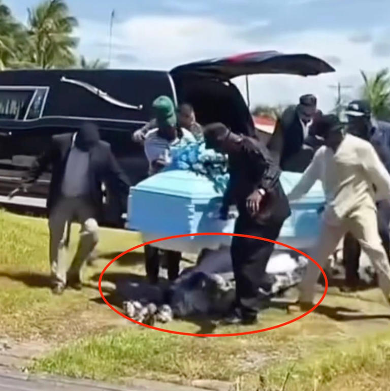 Stunning video shows body fall out of bottom of casket at funeral as ...