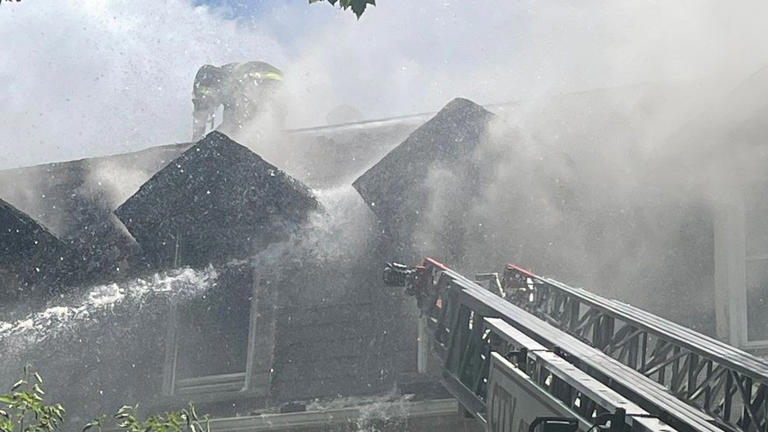Firefighter injured after fire rips through rowhomes in Baltimore