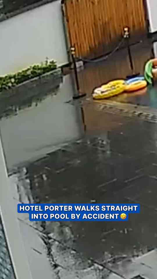 Hotel porter accidentally walks straight into swimming pool