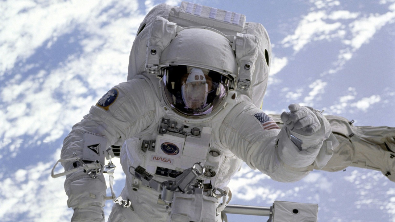 Two Russian cosmonauts are walking outside the space station today ...