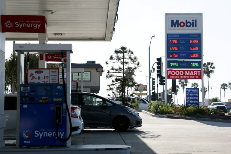 US revises first quarter growth down while inflation climbs