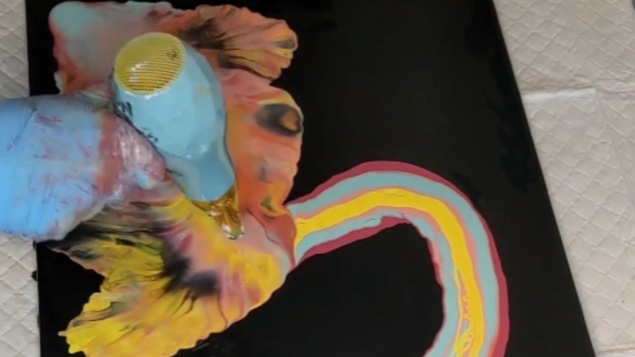 Artist's distinctive Dutch pour technique brings a joyful dragon to life