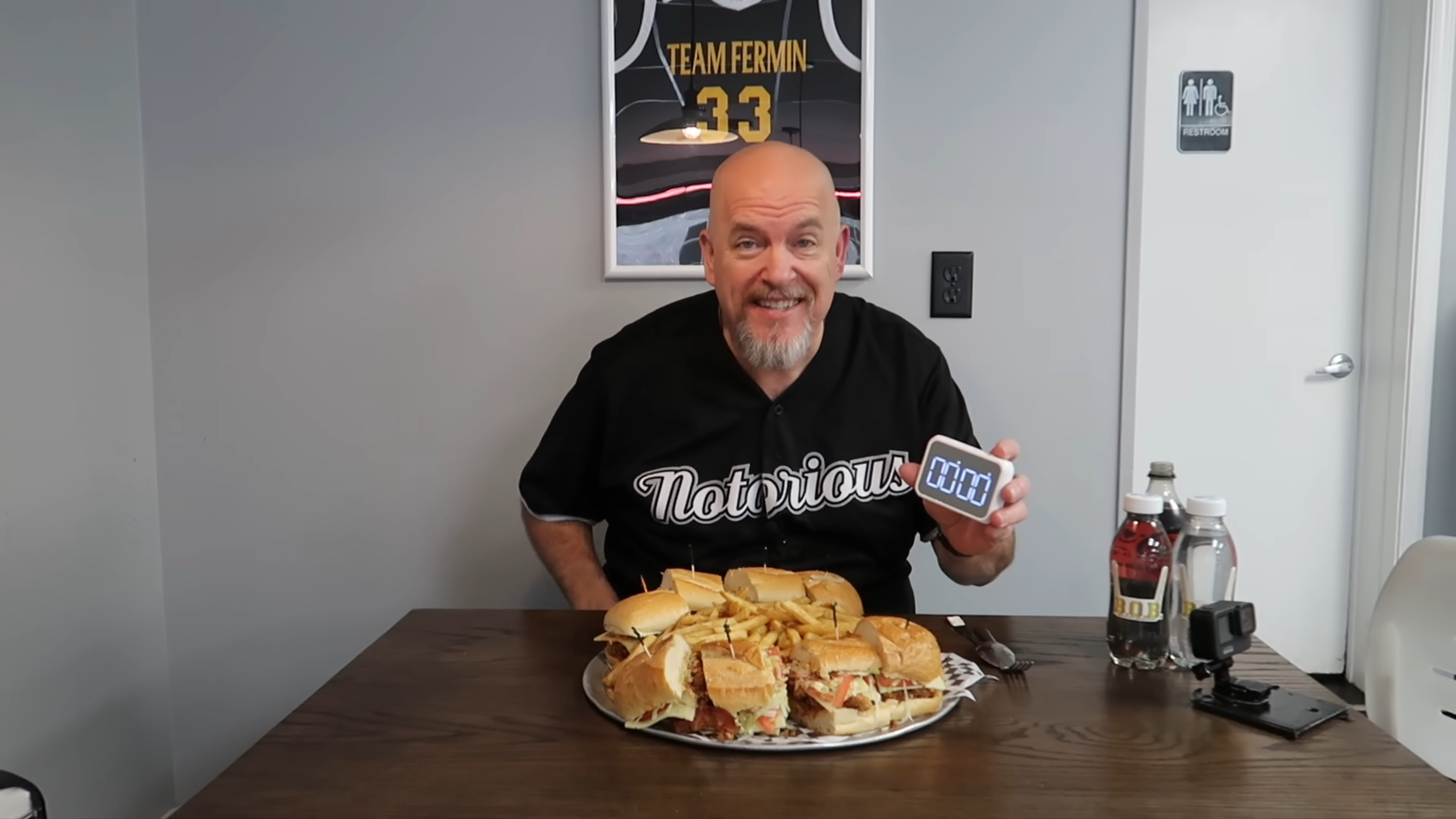 Old guy takes on huge sandwich – staff starts watching