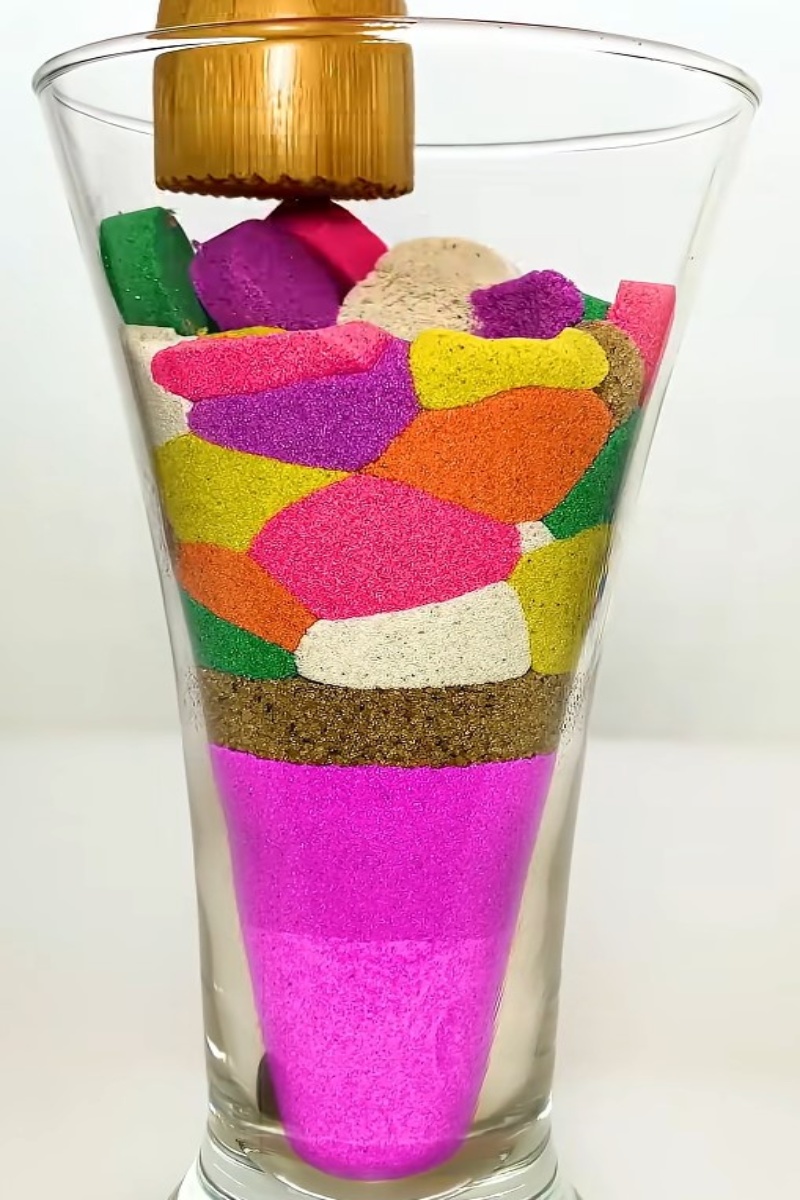 Vibrant layered sand art creation