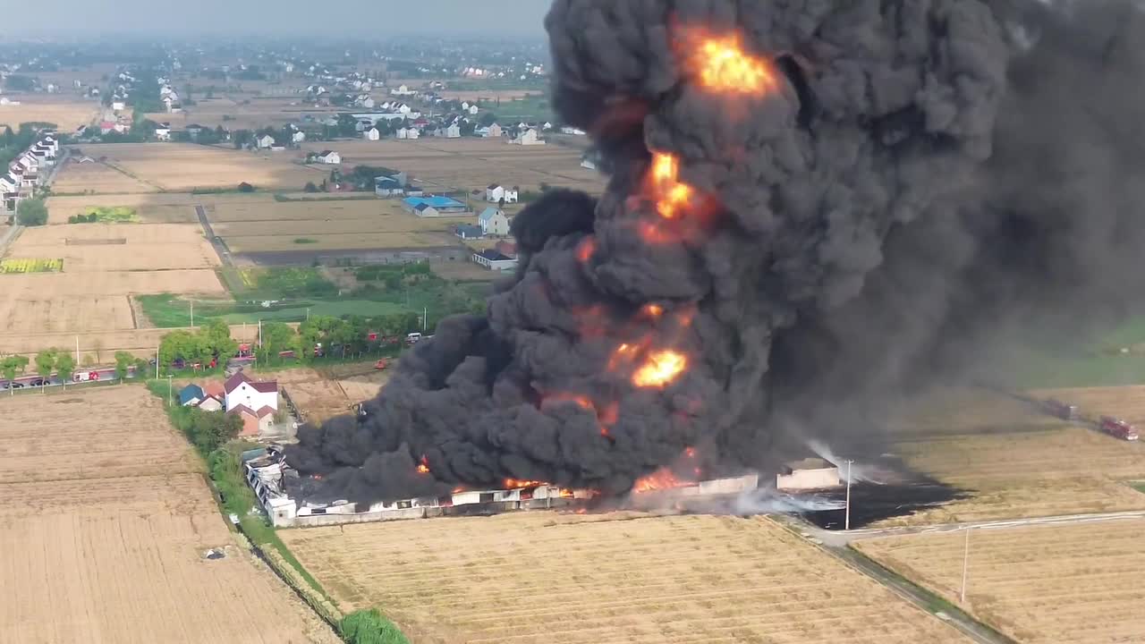 Fire erupts at lubricant factory, sending thick black smoke into the ...