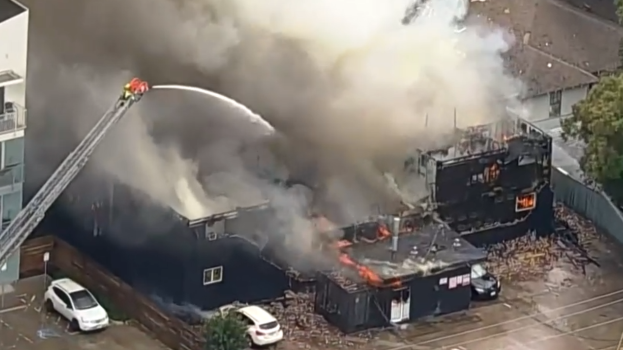 Nearly 100 firefighters battling major apartment fire, possible ...