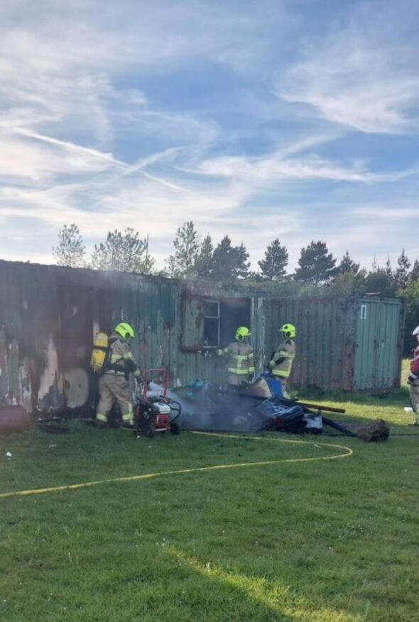 Boy, 13, arrested after child trapped in burning container in tiny UK ...