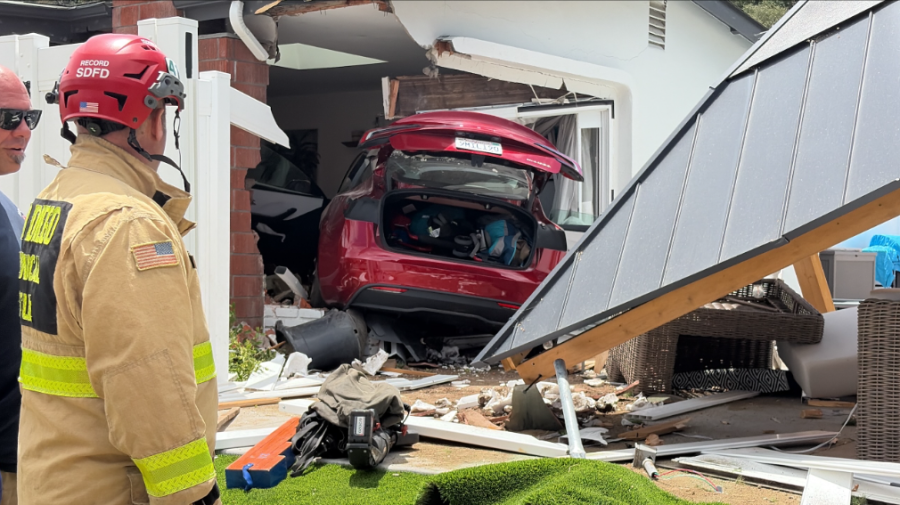Tesla smashes through fence into Clairemont home after striking vehicle ...