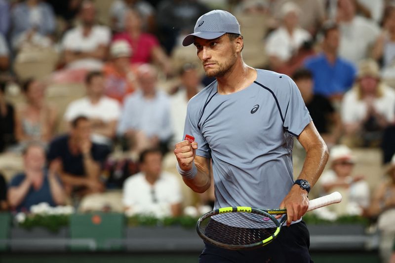 Tennis-Collignon shocks Shelton to reach French Open third round