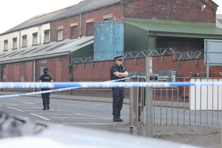 Police incident at Bury The Rock nears 48 hours as woman remains on car ...