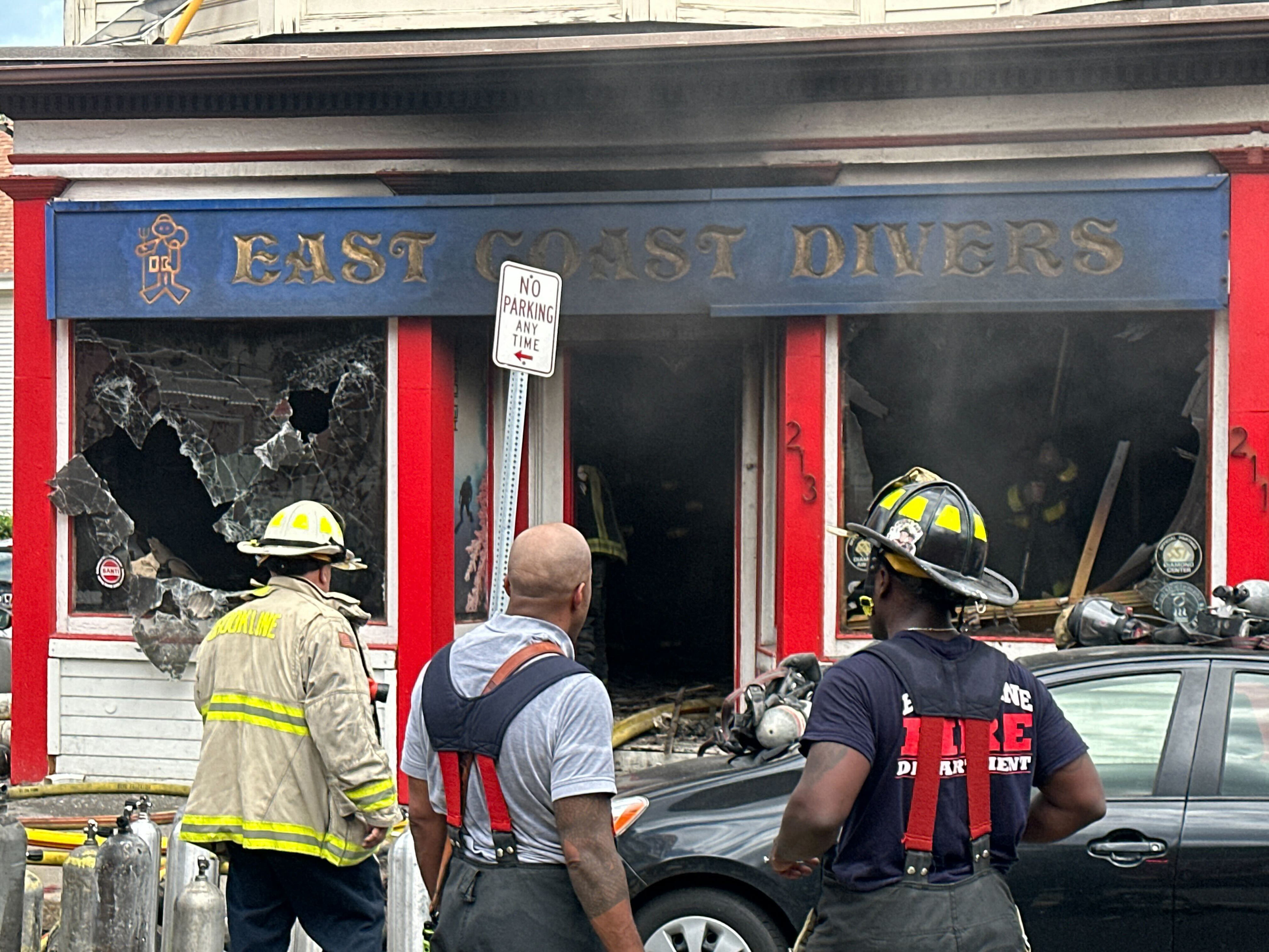 Worker burned during fire, explosions at Brookline dive shop