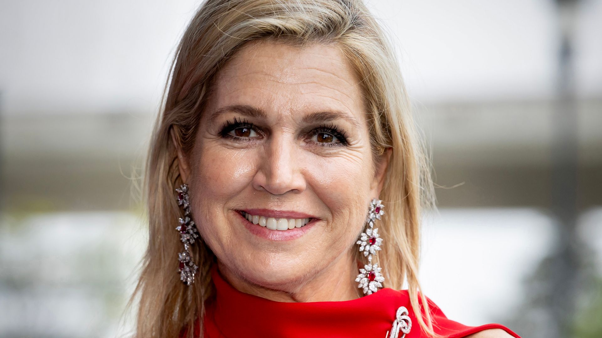 Queen Máxima embraces polished feminine silhouette in bold yellow ...