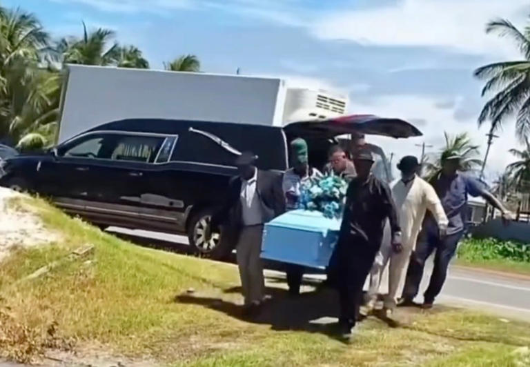 Stunning video shows body fall out of bottom of casket at funeral as ...
