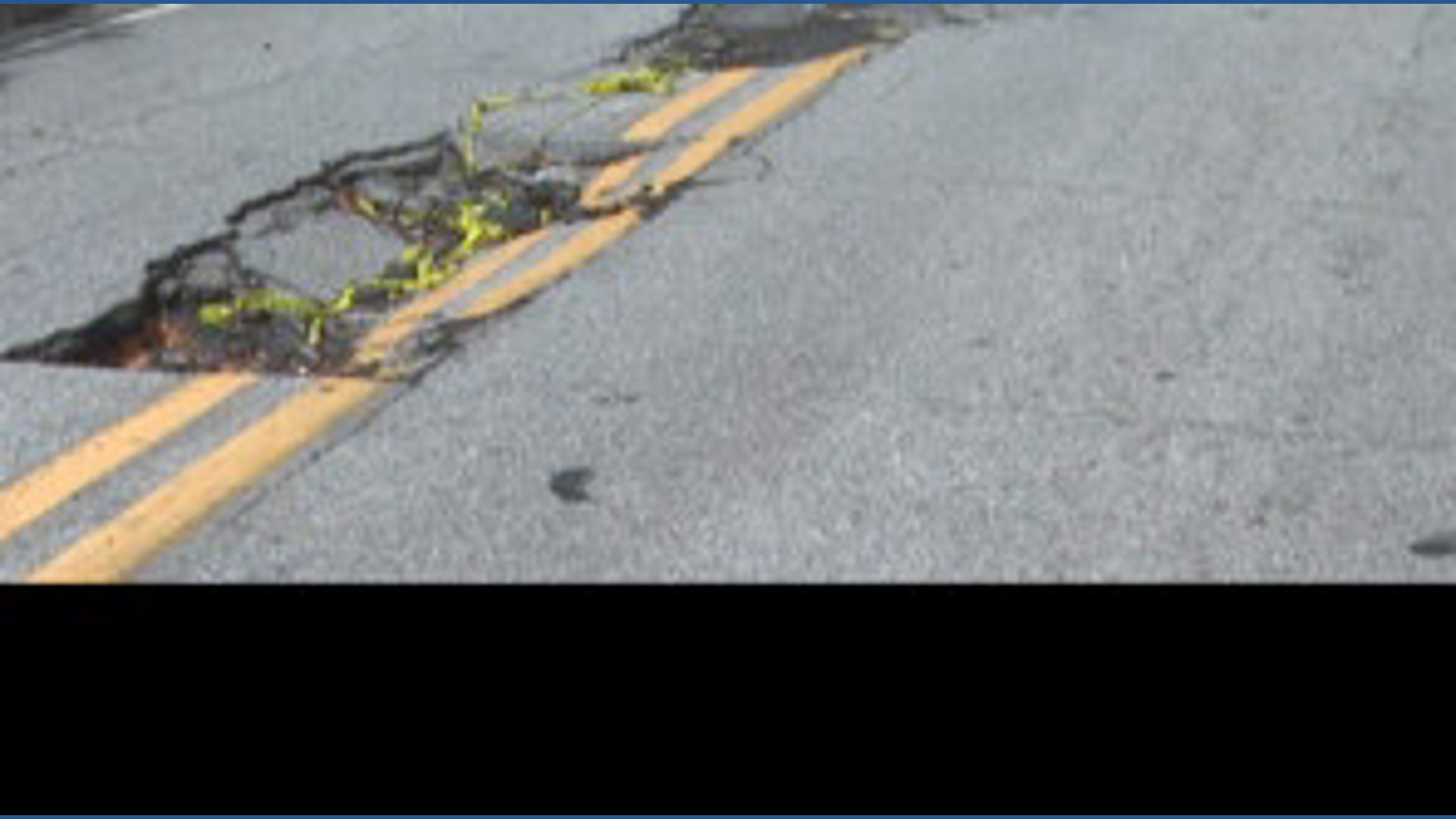 Damaged road on Mitchell St