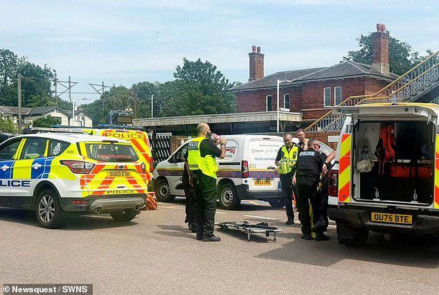 Man in his 40s is killed by train after escaping from custody van on ...