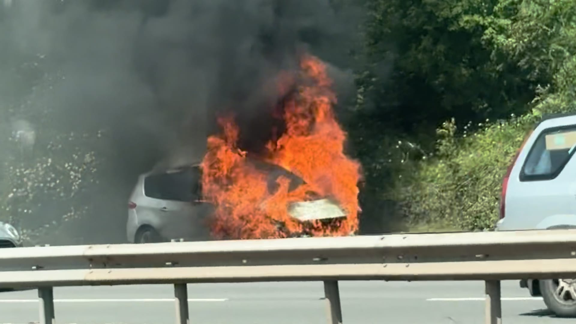 Car on highway engulfed in flames during UK May heatwave
