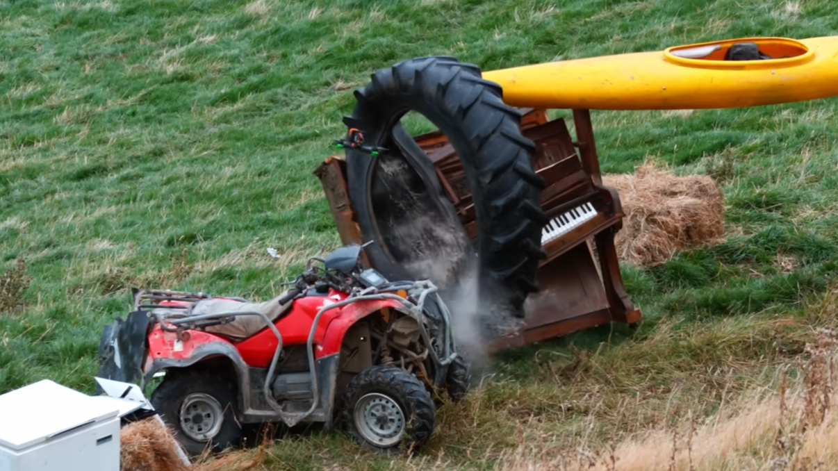 Watch what happens when a giant rogue tire hits a piano at full speed