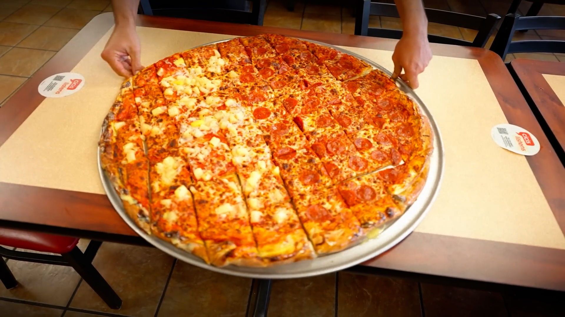 Man attempts giant 28-inch pizza challenge with 64 slices and two drinks