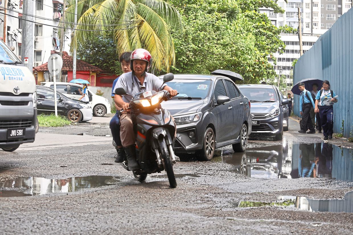 Potholes wreck Wangsa Maju road
