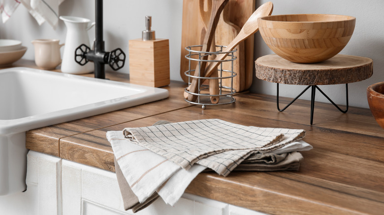 Repurpose old dish towels in your fridge and keep everything tidy
