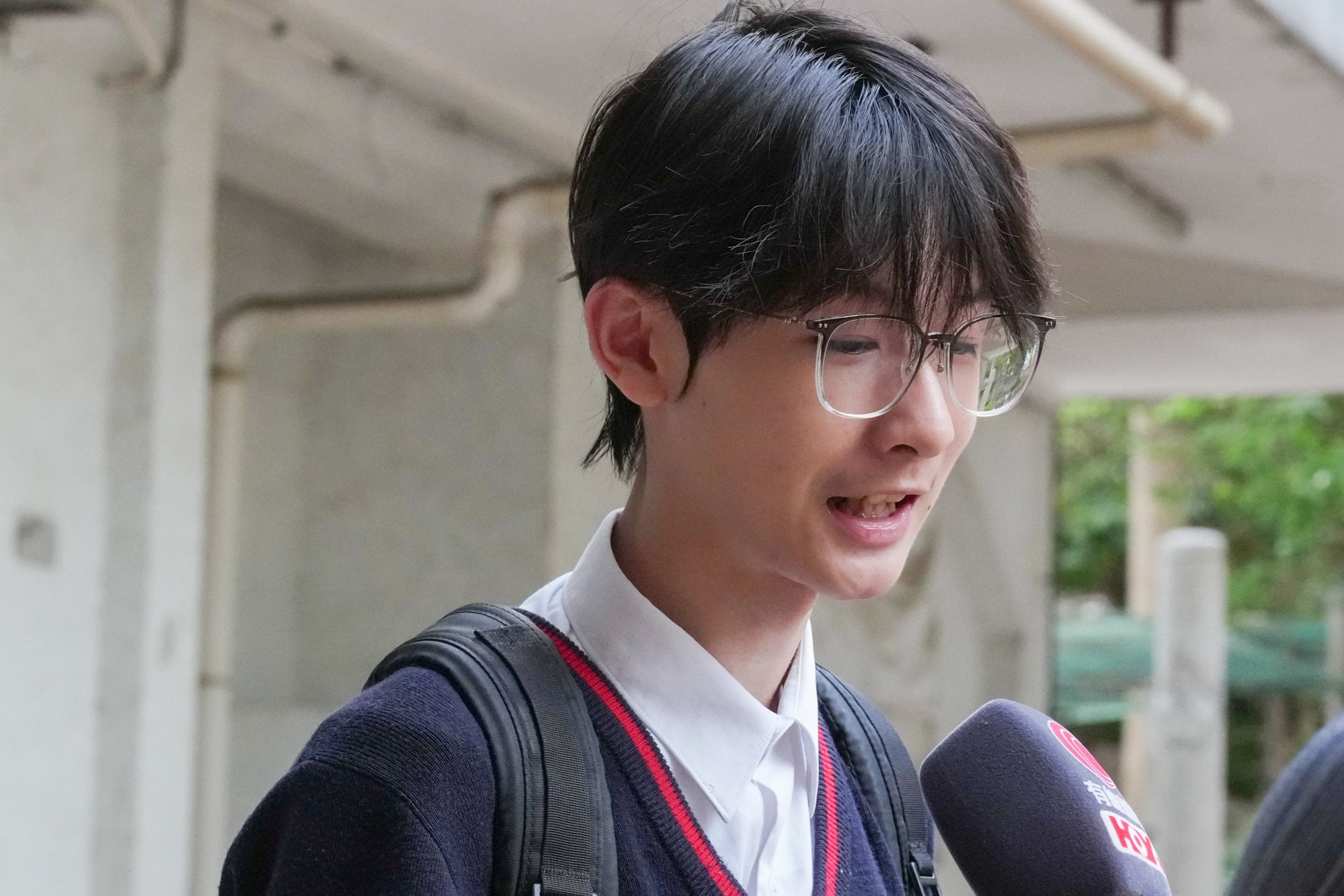 Students divided over Hong Kong principal’s resignation after Singapore ...
