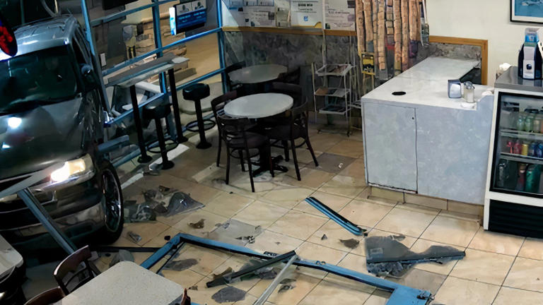 Chevy Tahoe smashes into a donut shop before starting a police chase