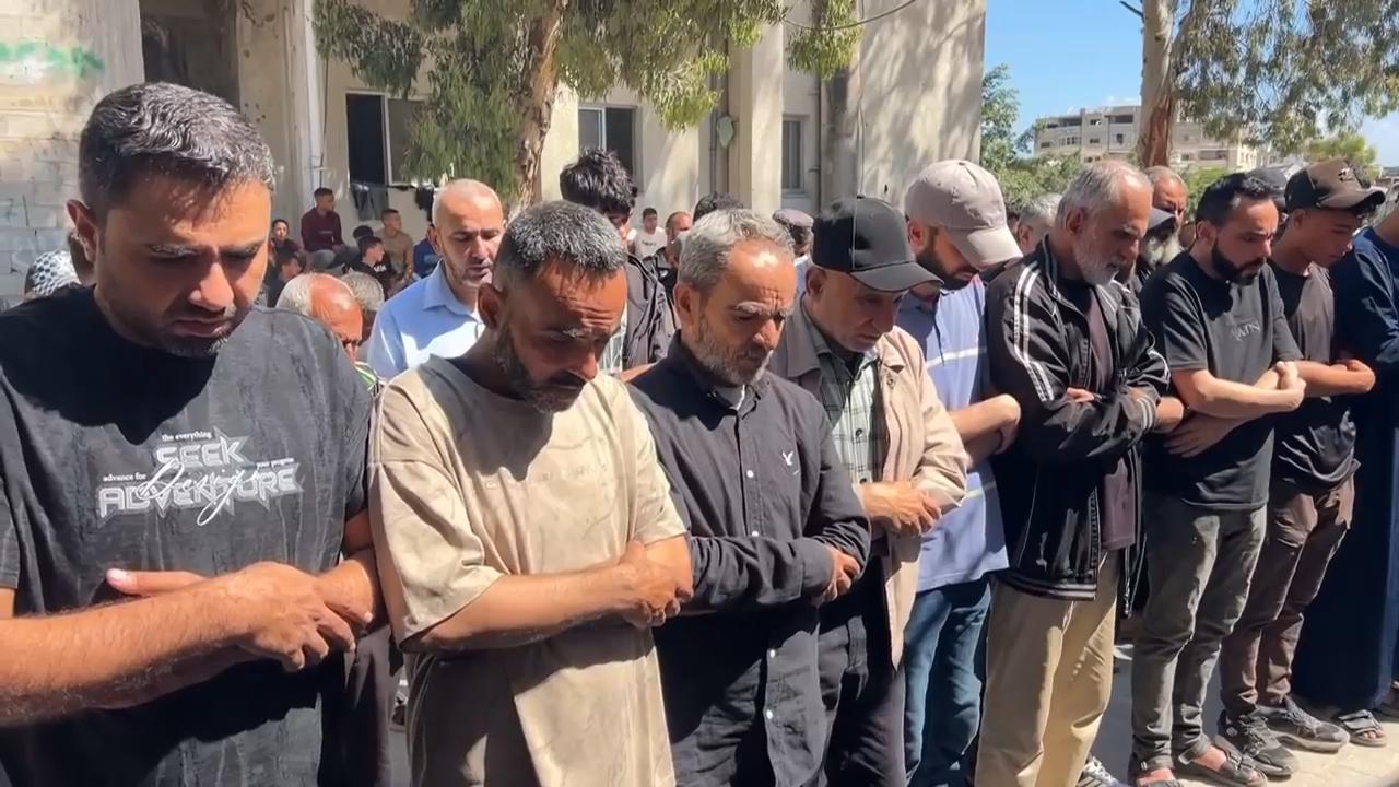 Mourners gather for the funeral of 10 people killed in Israeli strikes ...