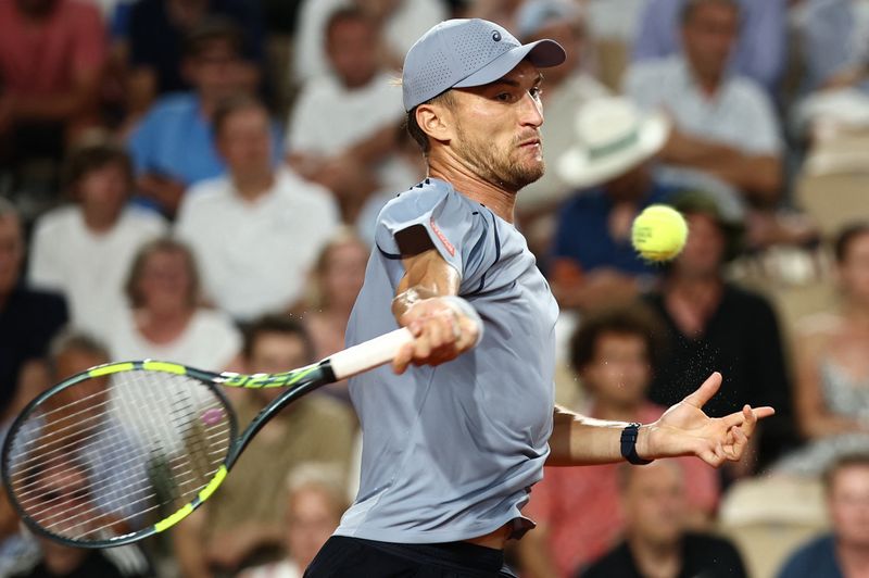 Tennis-Collignon shocks Shelton to reach French Open third round