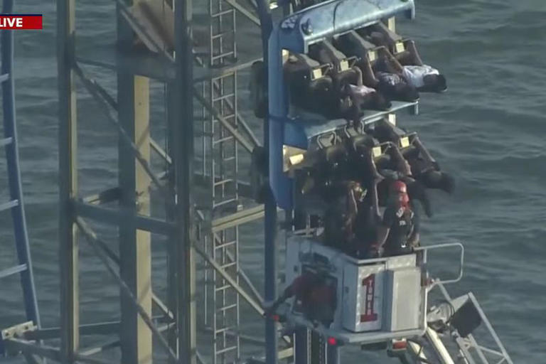 Texas roller coaster breaks down as riders left dangling midair in ...