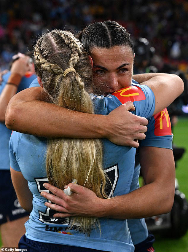 Innocent image of Millie Elliott feeding her baby after State of Origin ...