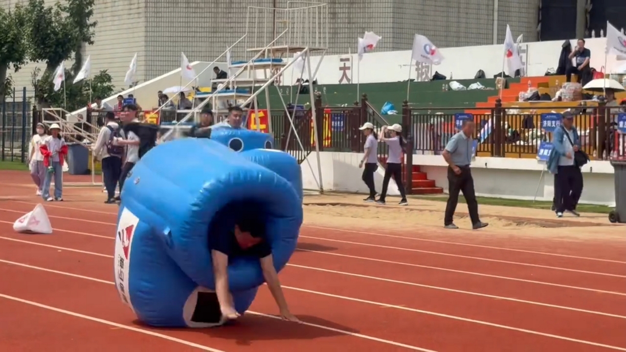 Hilarious fall at inflatable shoe race in China