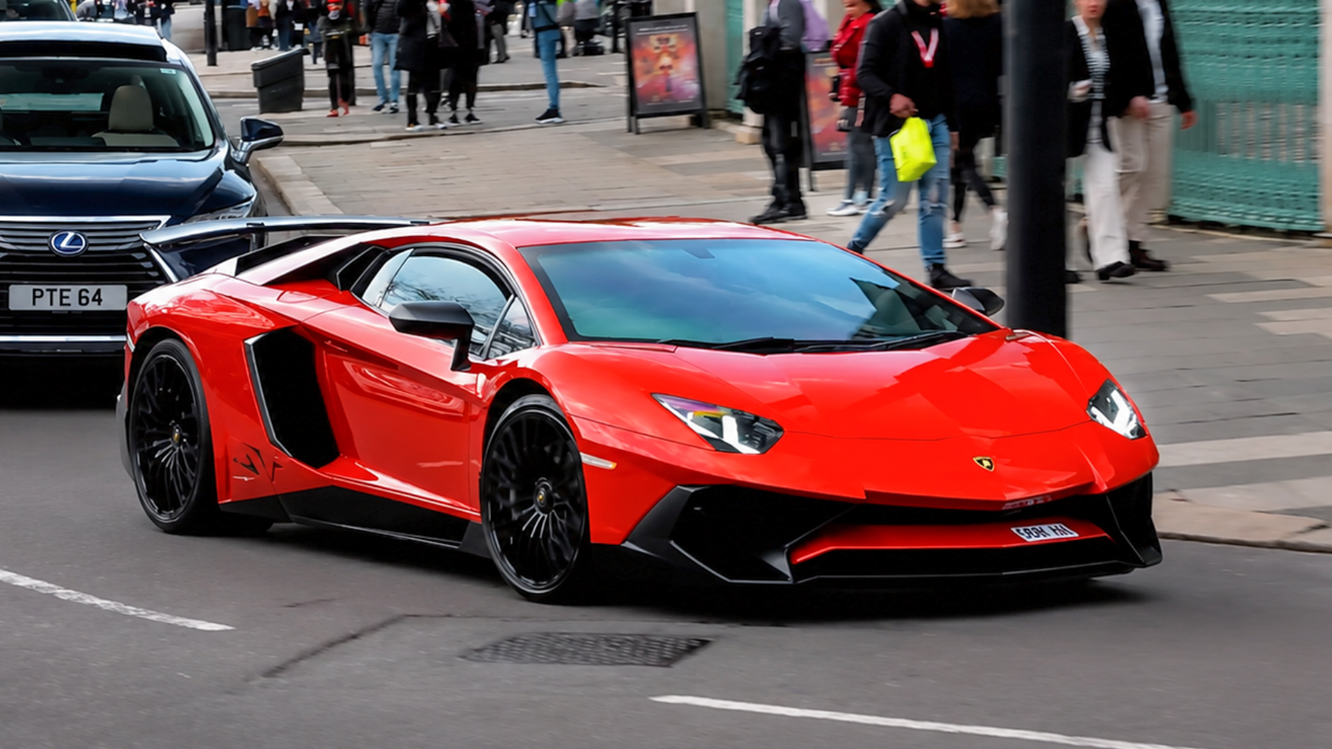 Red $800K Lamborghini Aventador SVJ in London traffic