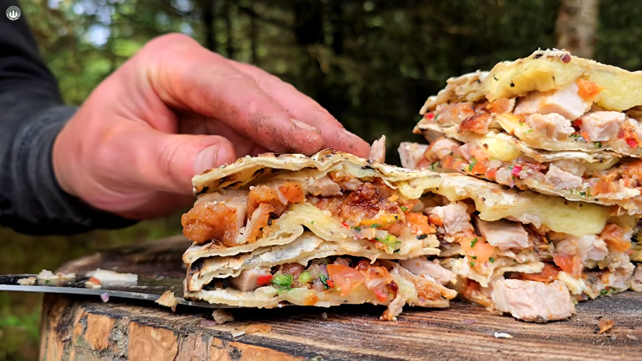 Watch how this pork belly quesadilla crisps up over open fire