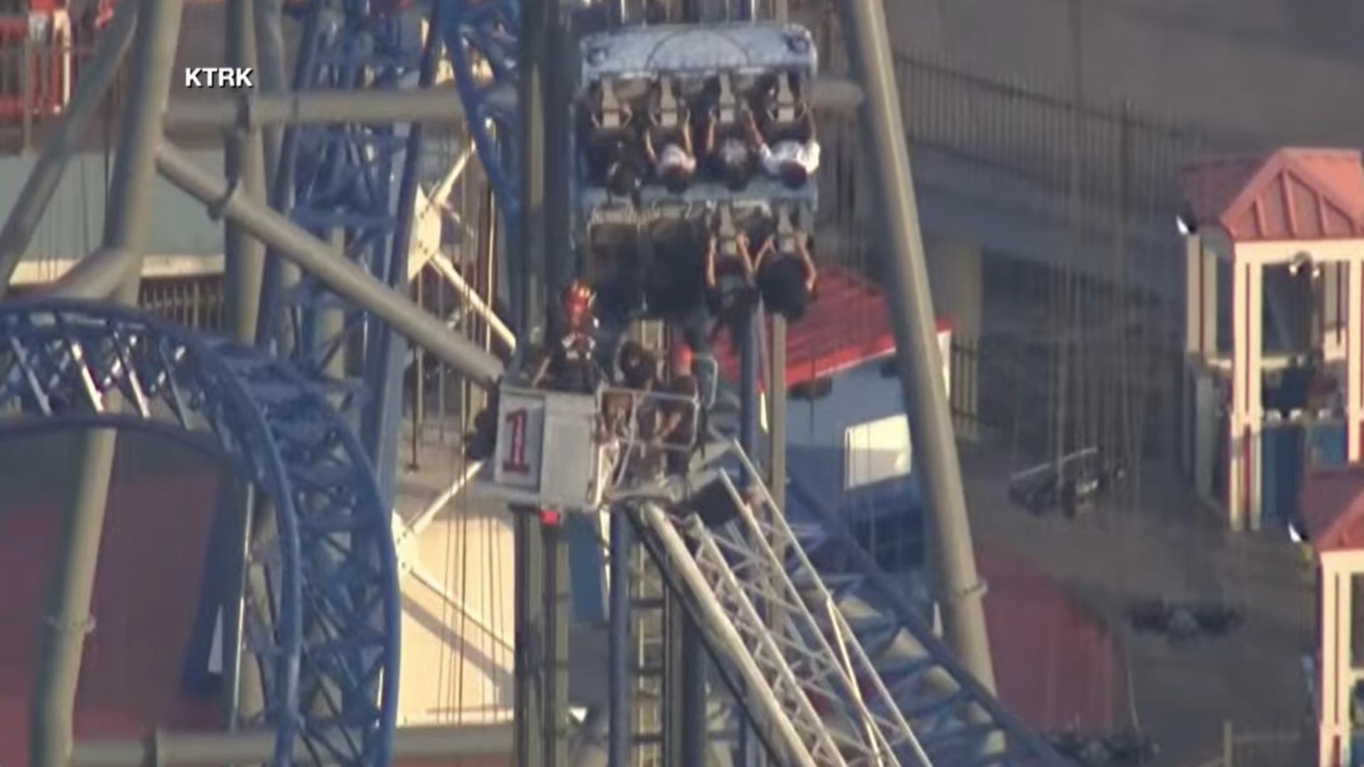 Riders get stuck on 100-foot high roller coaster in Texas before daring ...