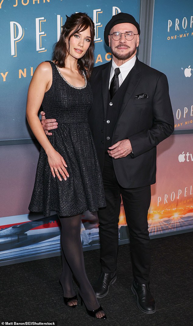 John Travolta continues to sport his kooky new look with another beret