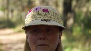 Bird eats from visitor's hat in magical park moment