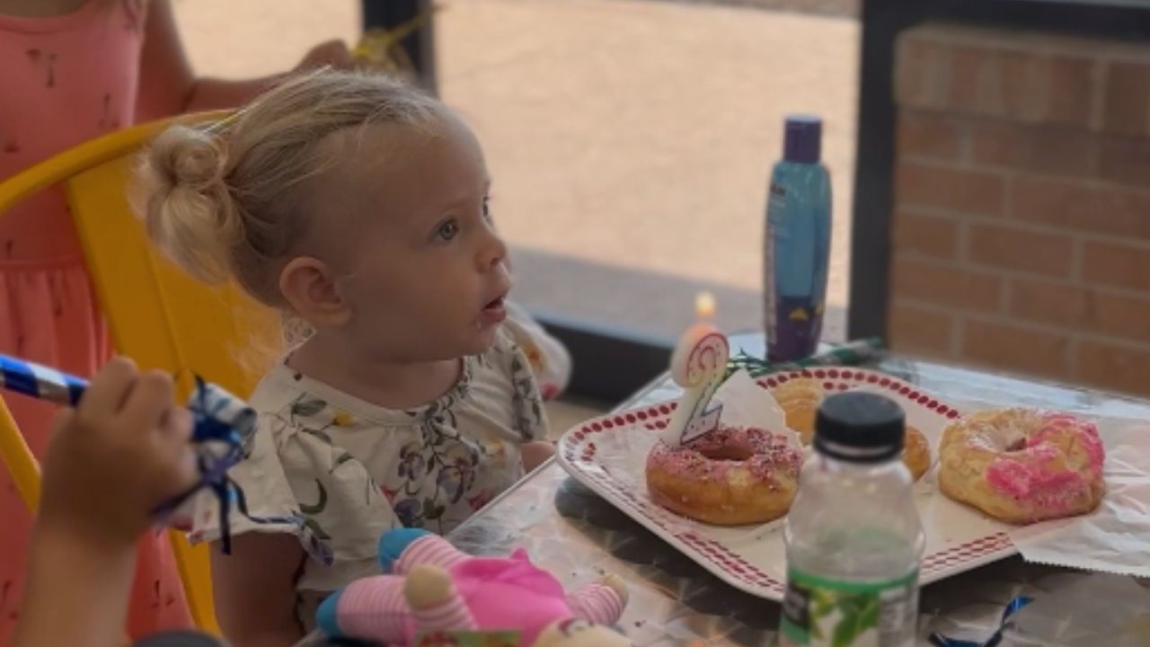 Fearless 2 y/o girl thinks that cake candles are edible