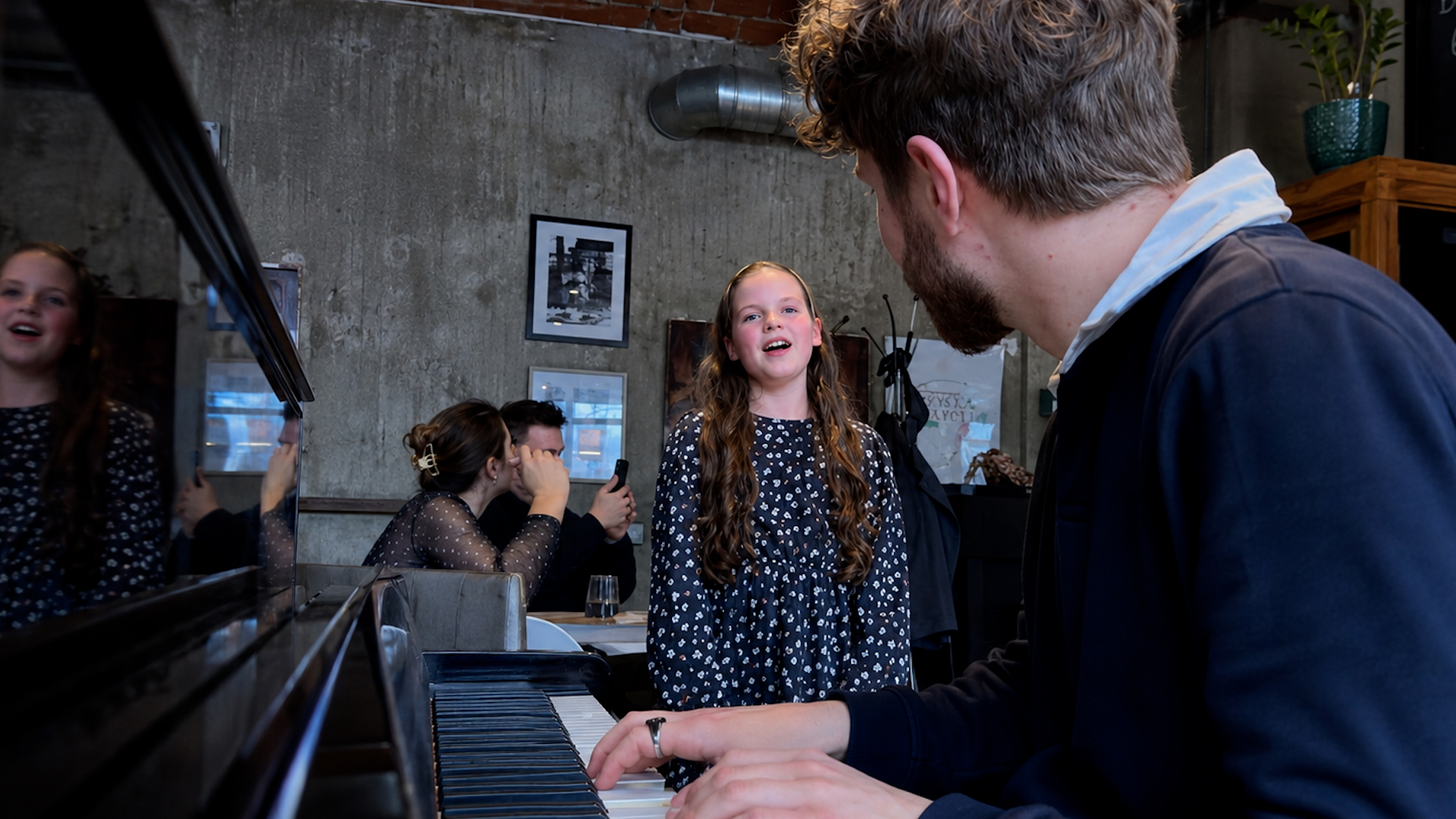 Watch when she starts singing at the piano