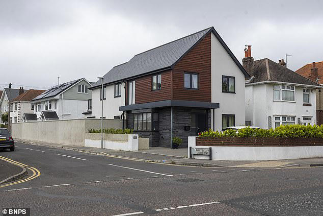 Homeowner wins planning fight with angry neighbours over 7ft concrete ...